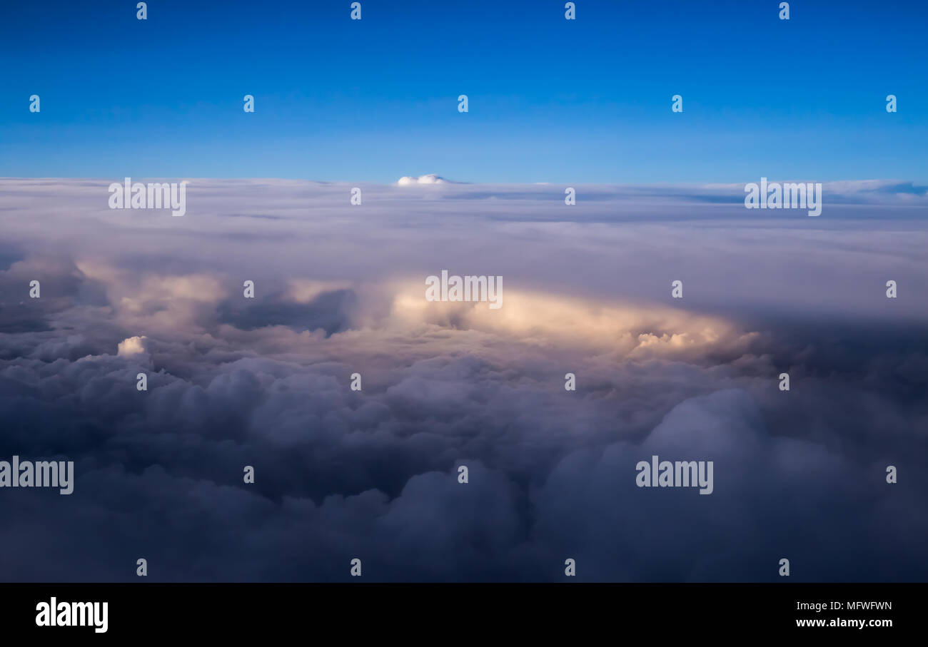 Airplane above clouds sunrise hi-res stock photography and images - Alamy