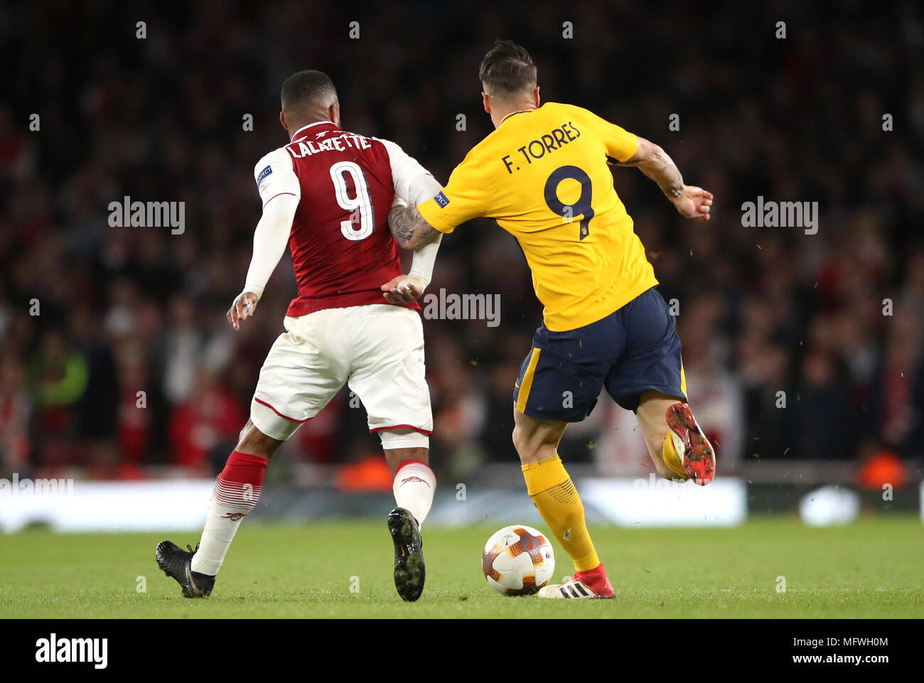 Arsenal's Alexandre Lacazette (left) and Atletico Madrid's Fernando ...