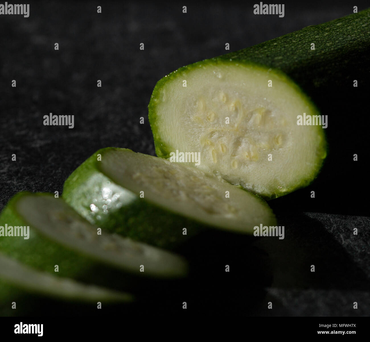 A courgette, sliced Stock Photo - Alamy