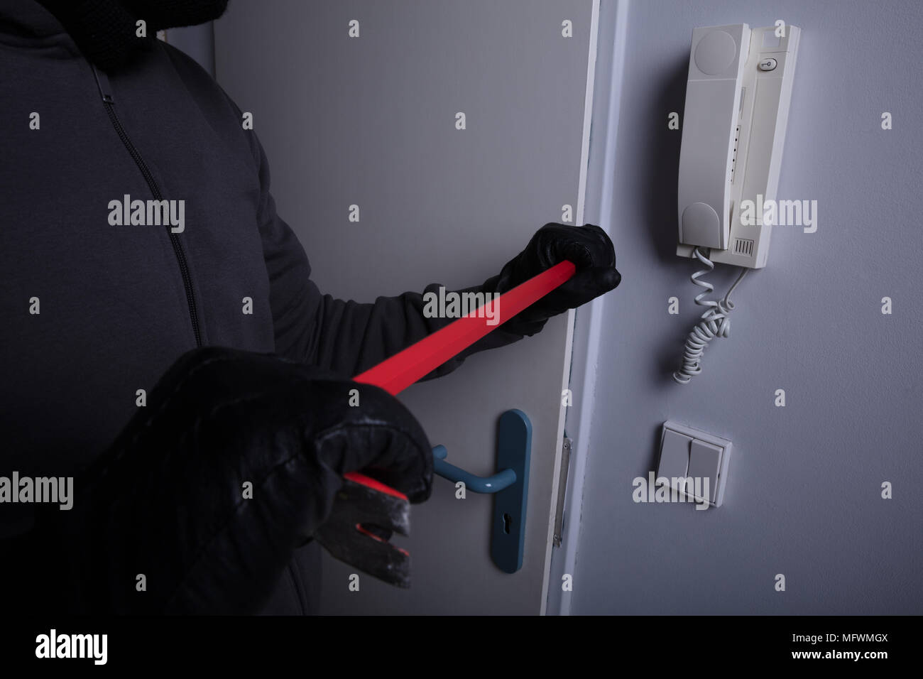Thief holding crowbar hi-res stock photography and images - Alamy