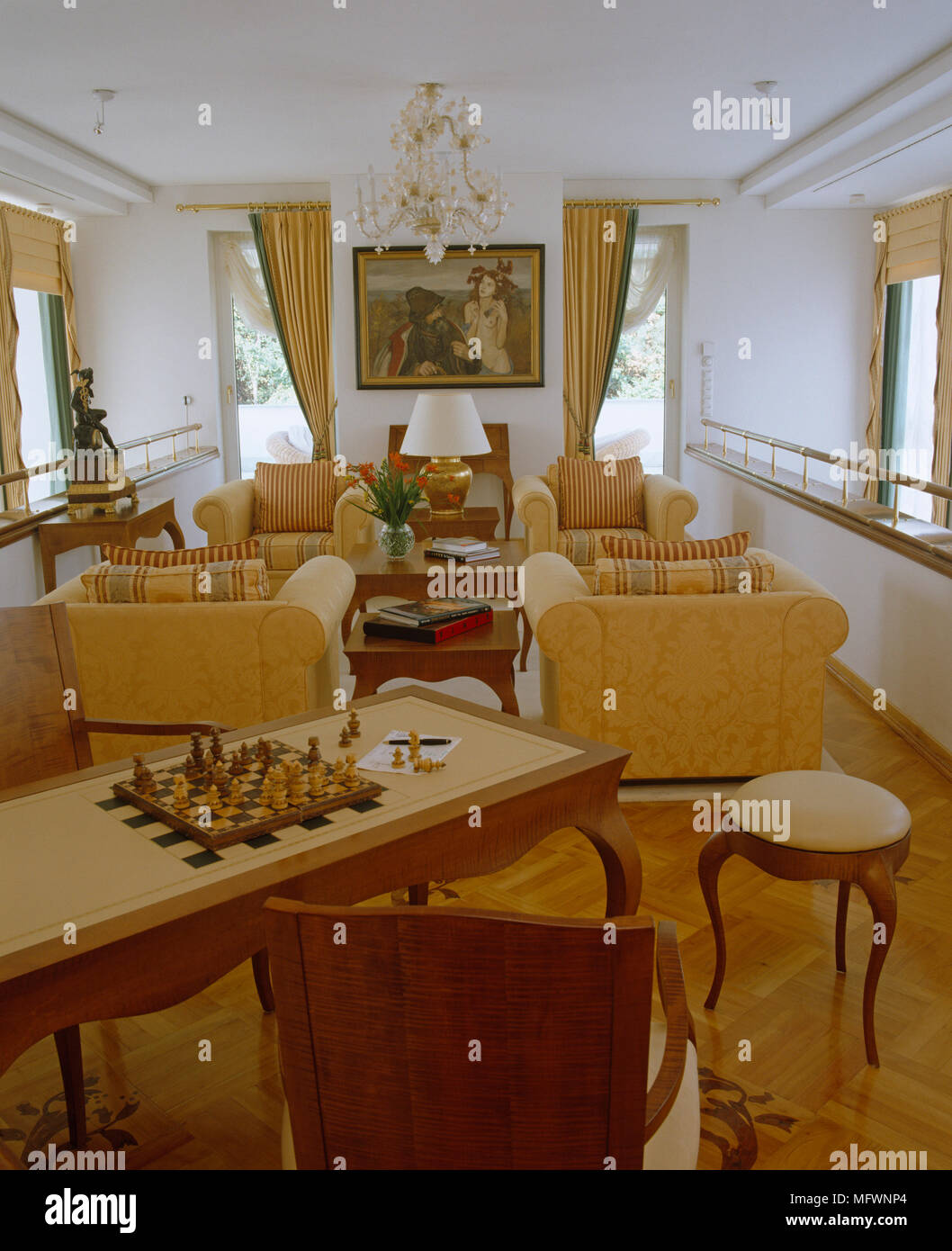 Chess game in progress on table in luxurious sitting room Stock Photo ...