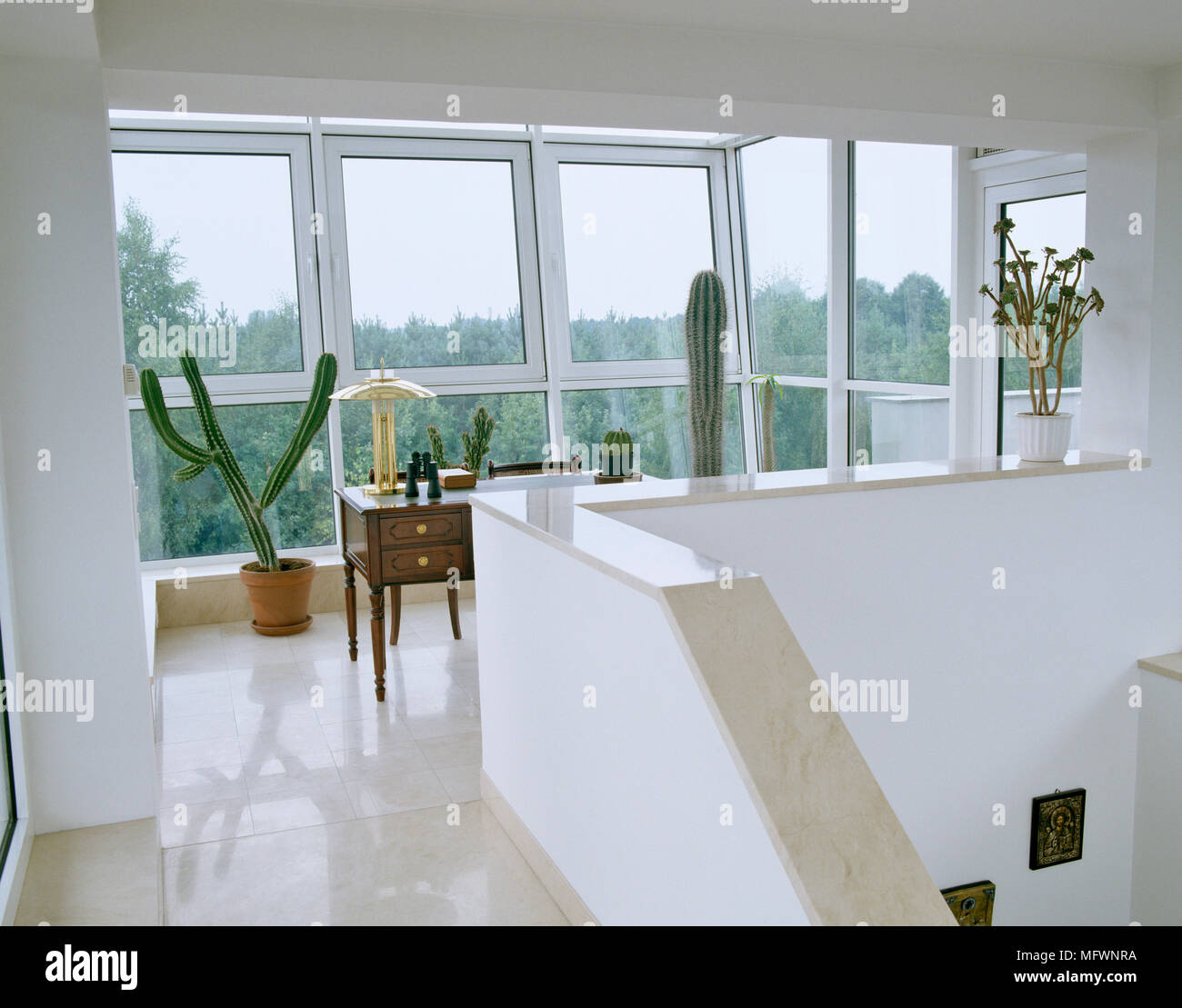 Study area on landing with desk in front of window Stock Photo - Alamy