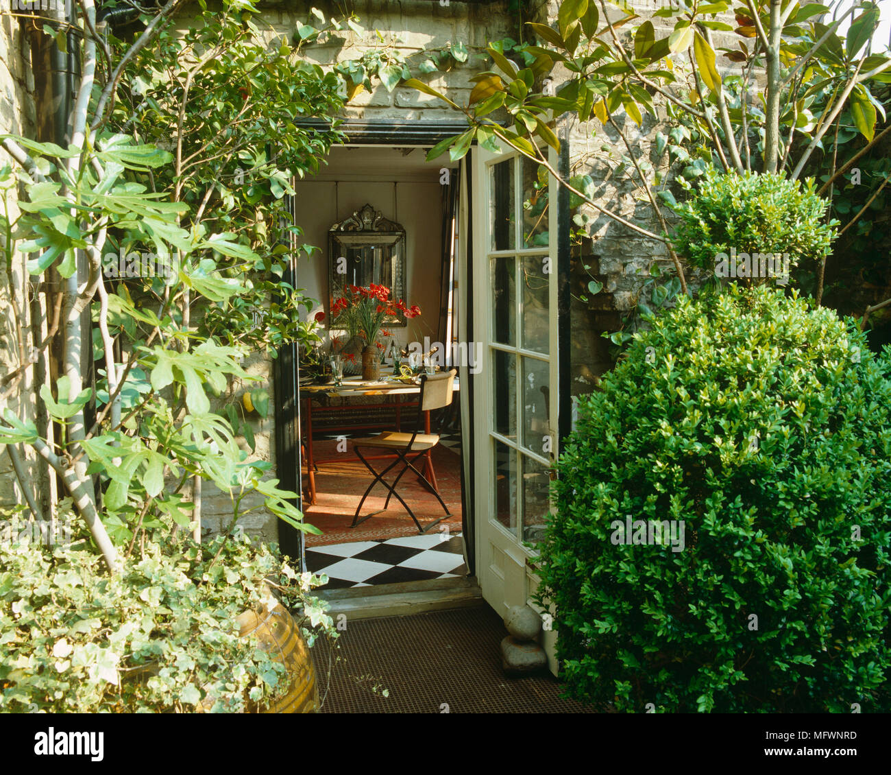 View through open door to dining room beyond Stock Photo - Alamy