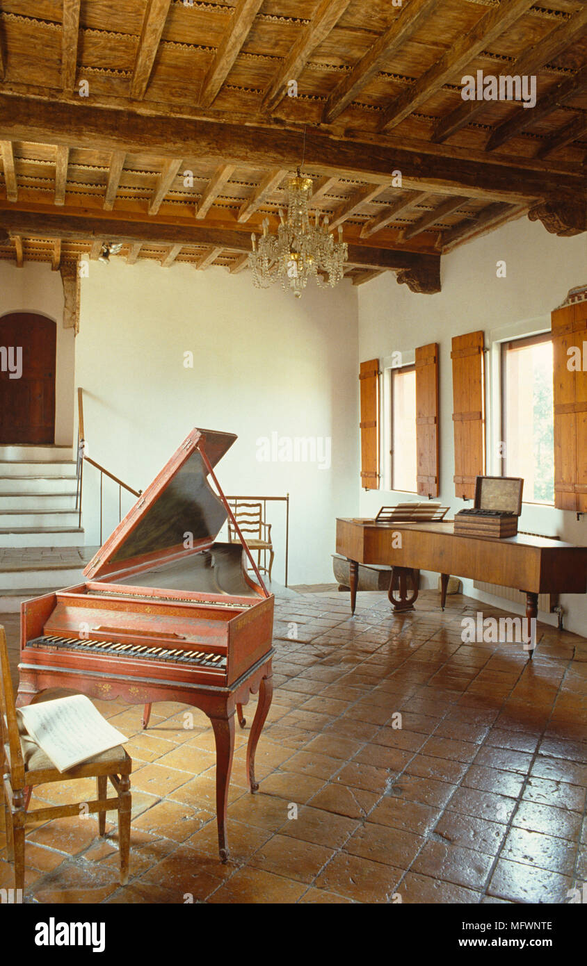 Antique pianos in country style music room Stock Photo - Alamy