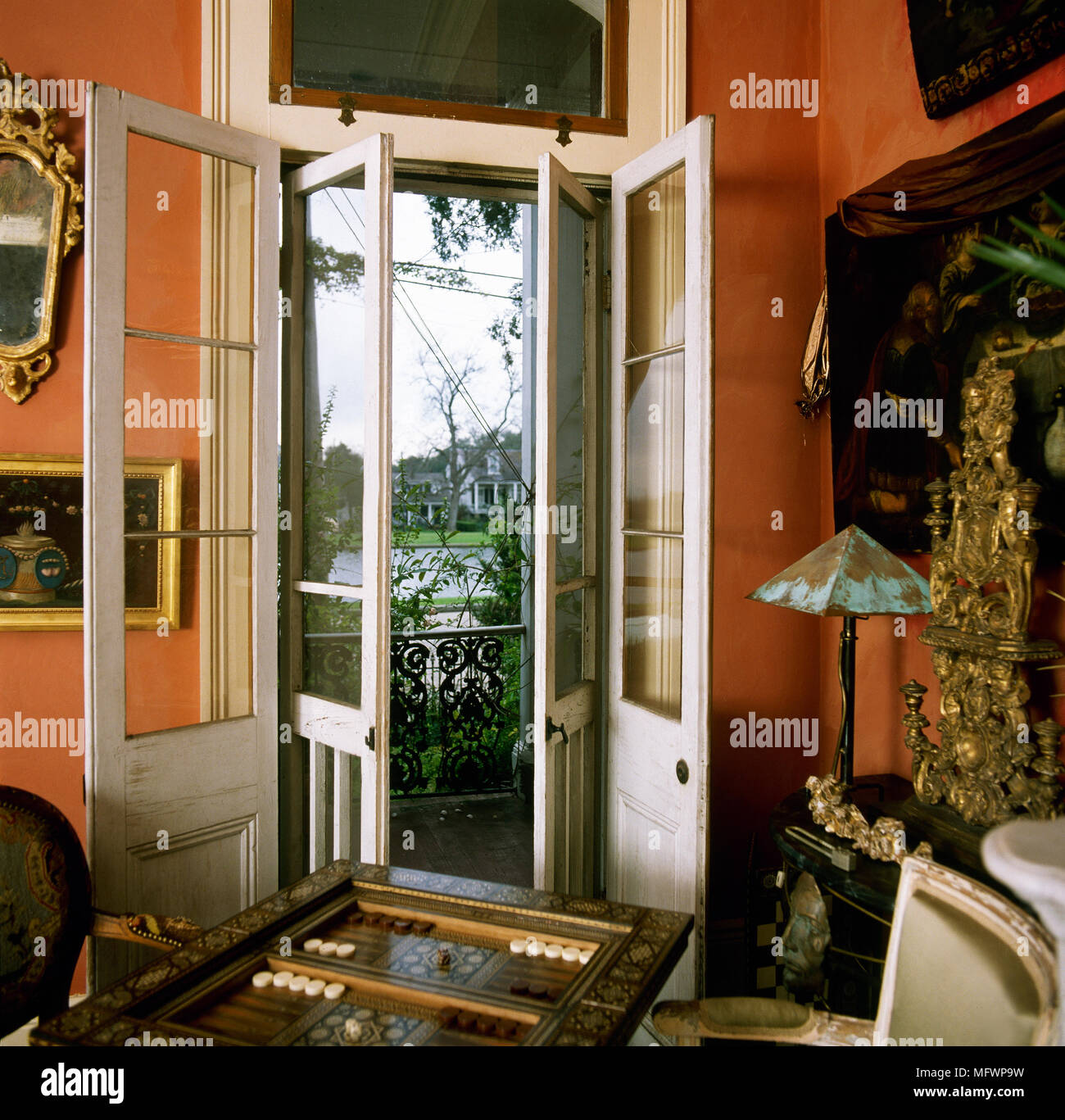 Open French double doors into red room Stock Photo - Alamy
