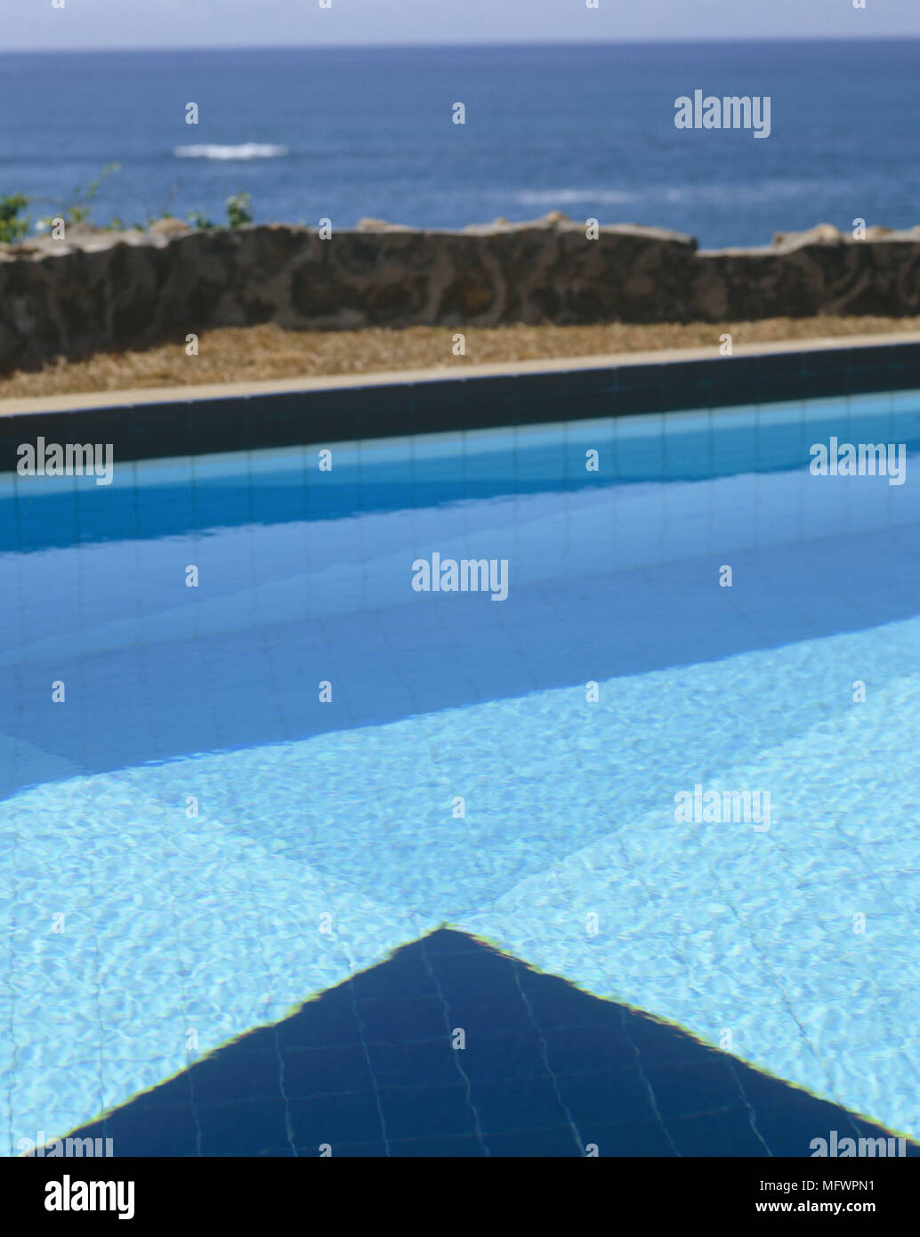 View overlooking swimming pool out to ocean Stock Photo - Alamy