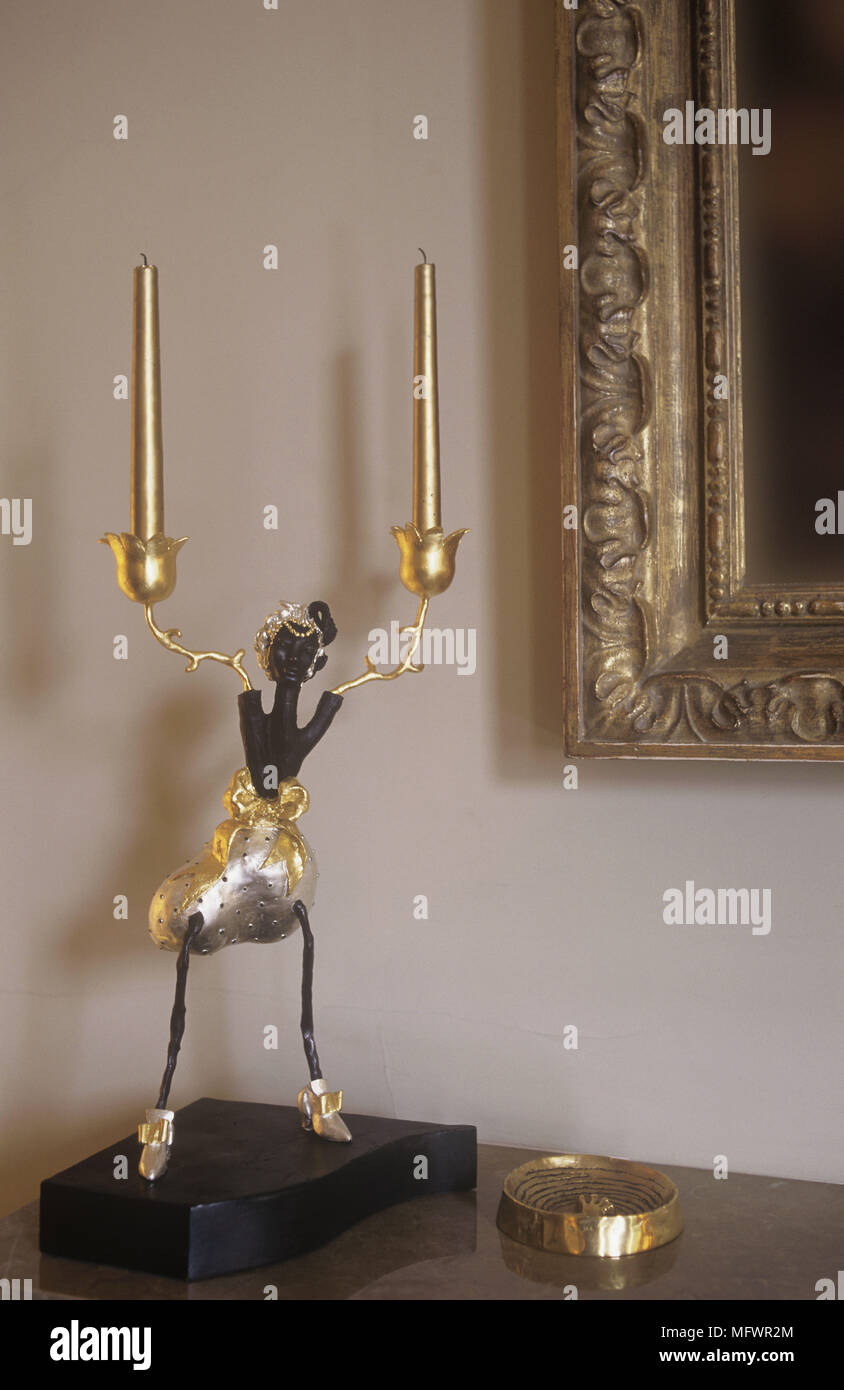Figurative candlestick on side table Stock Photo - Alamy