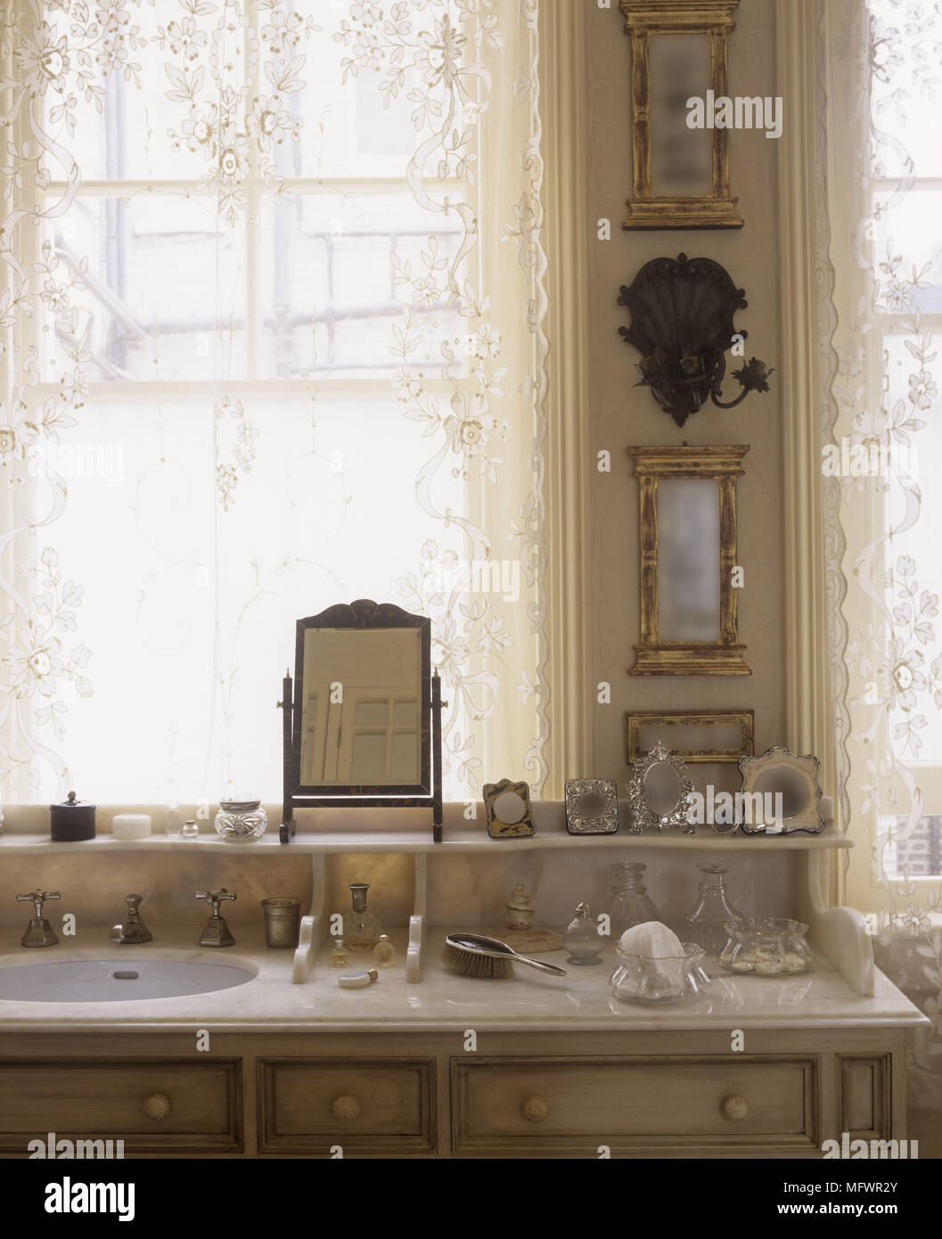 Dressing table with washbasin beneath window Stock Photo - Alamy