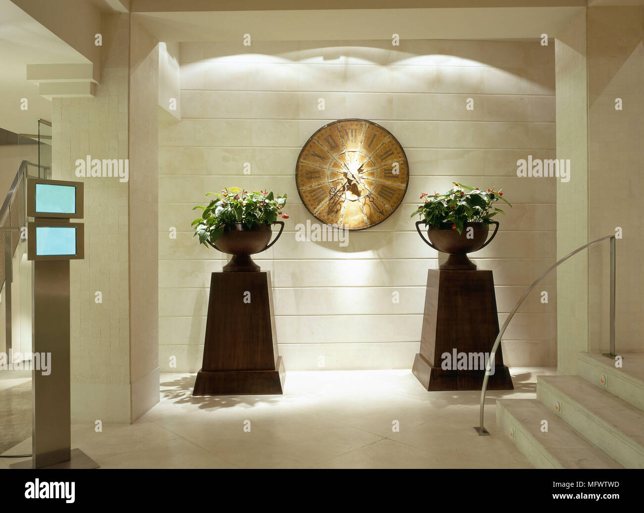 Flower pots in a hallway Stock Photo - Alamy
