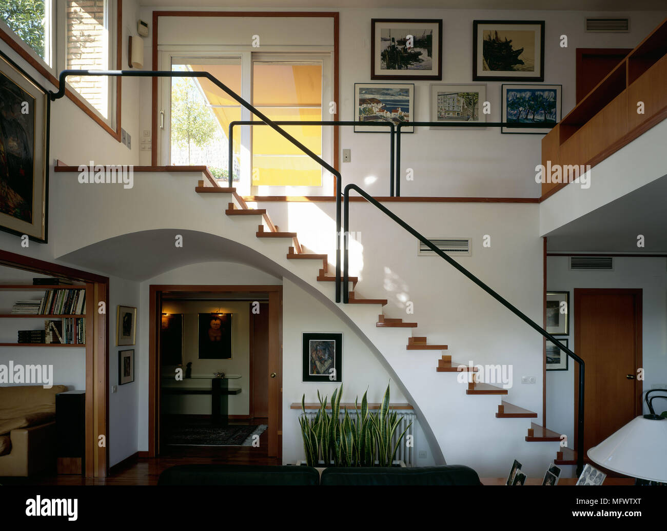 Open plan staircase wth arched feature Stock Photo - Alamy