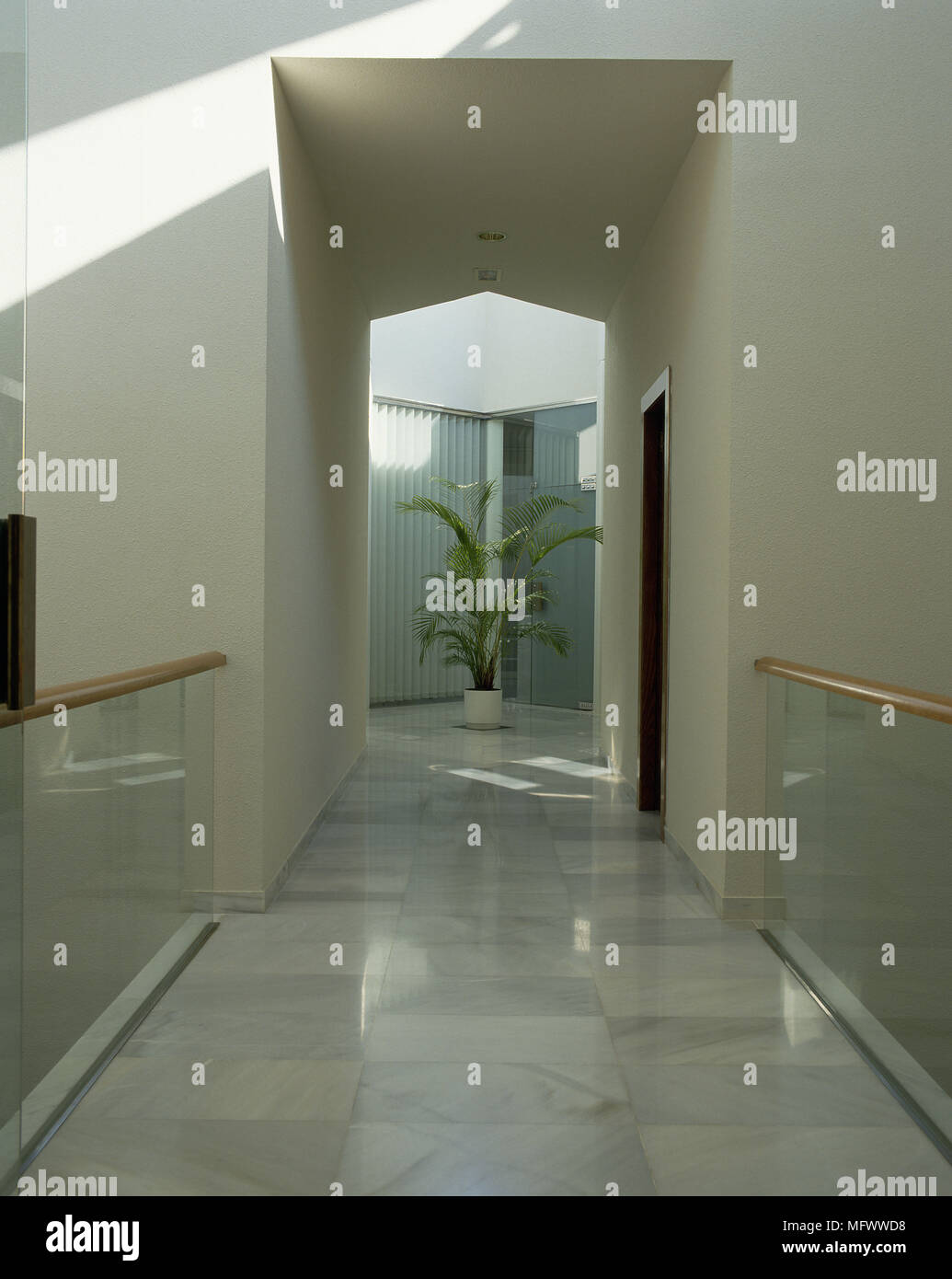 View of a narrow corridor tiled in marble Stock Photo - Alamy