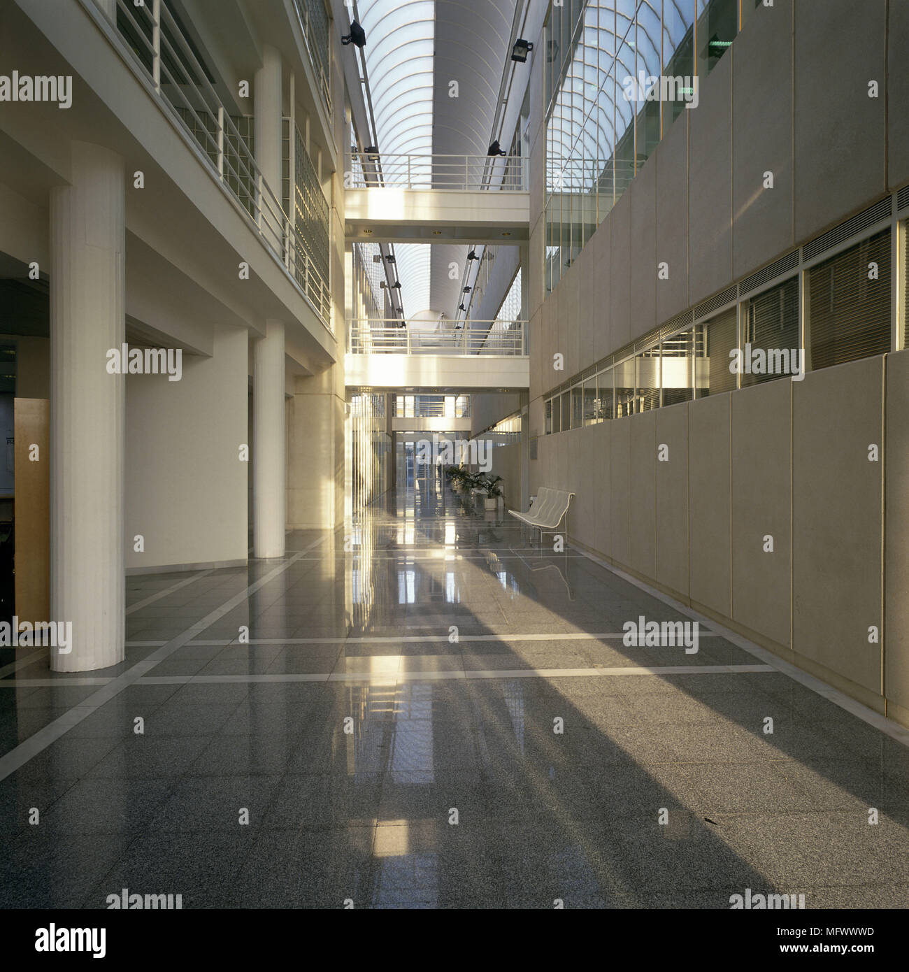 View of an eclectic hallway inside an office building Stock Photo - Alamy