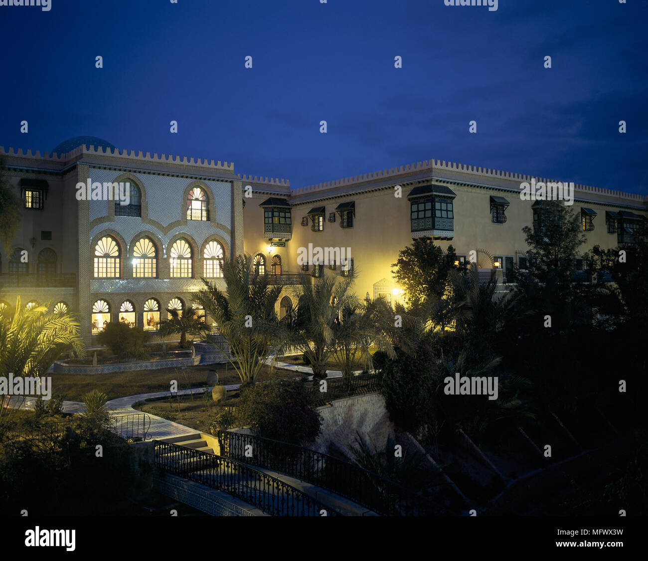 View of an illuminated hotel at night Stock Photo - Alamy