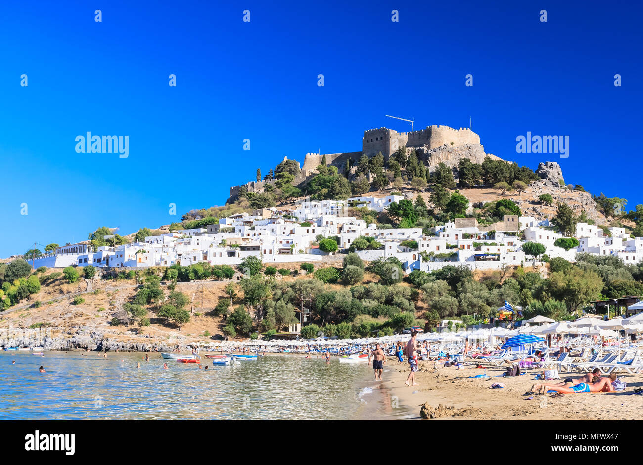 Beach in the city of Lindos. Rhodes Island. Greece Stock Photo - Alamy