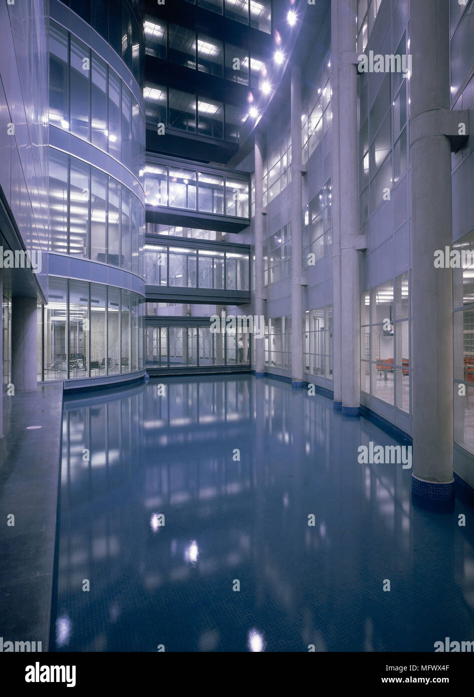 View of an illuminated office building Stock Photo - Alamy