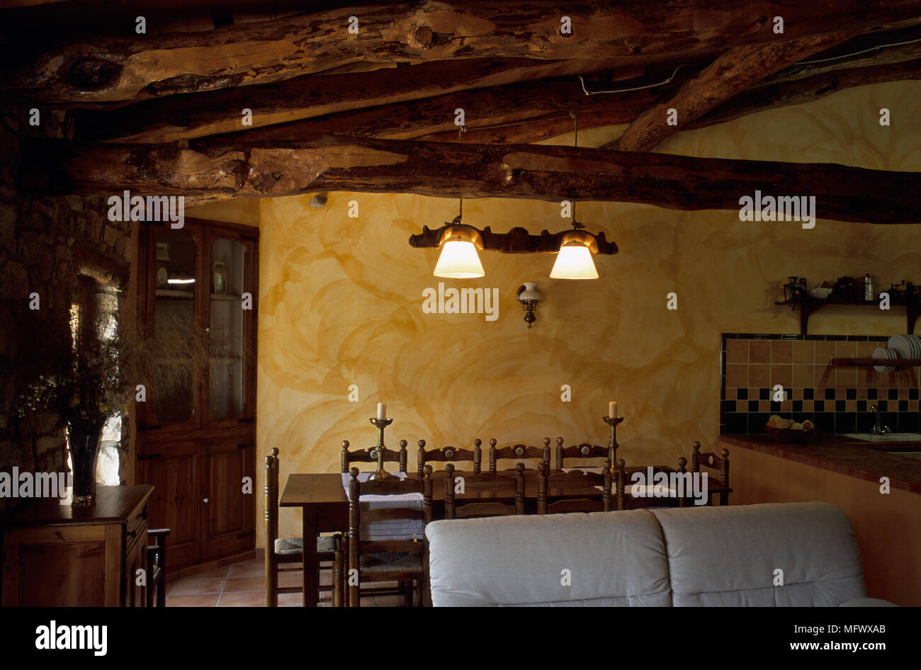 View of illuminated lamps above a dining table Stock Photo - Alamy