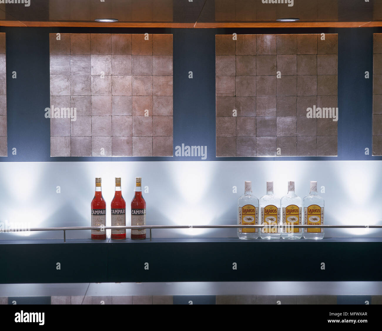 View of liquor bottles displayed at a bar counter Stock Photo - Alamy