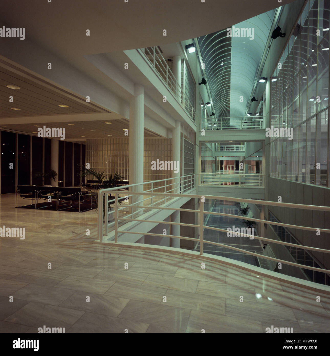 View of railings surrounding an atrium of a building Stock Photo - Alamy
