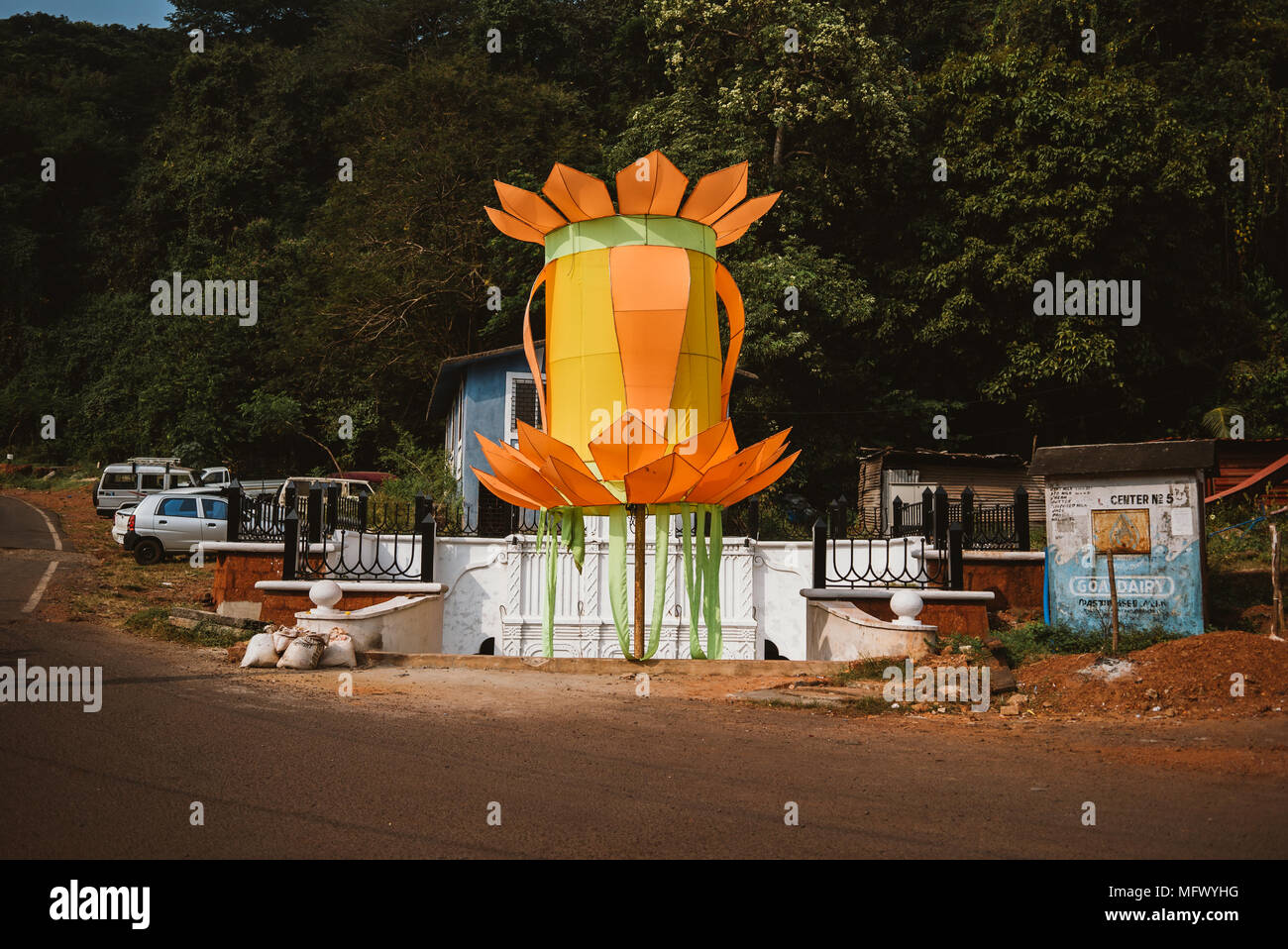 colorful orange shrine on a quiet street in Goa, India Stock Photo - Alamy