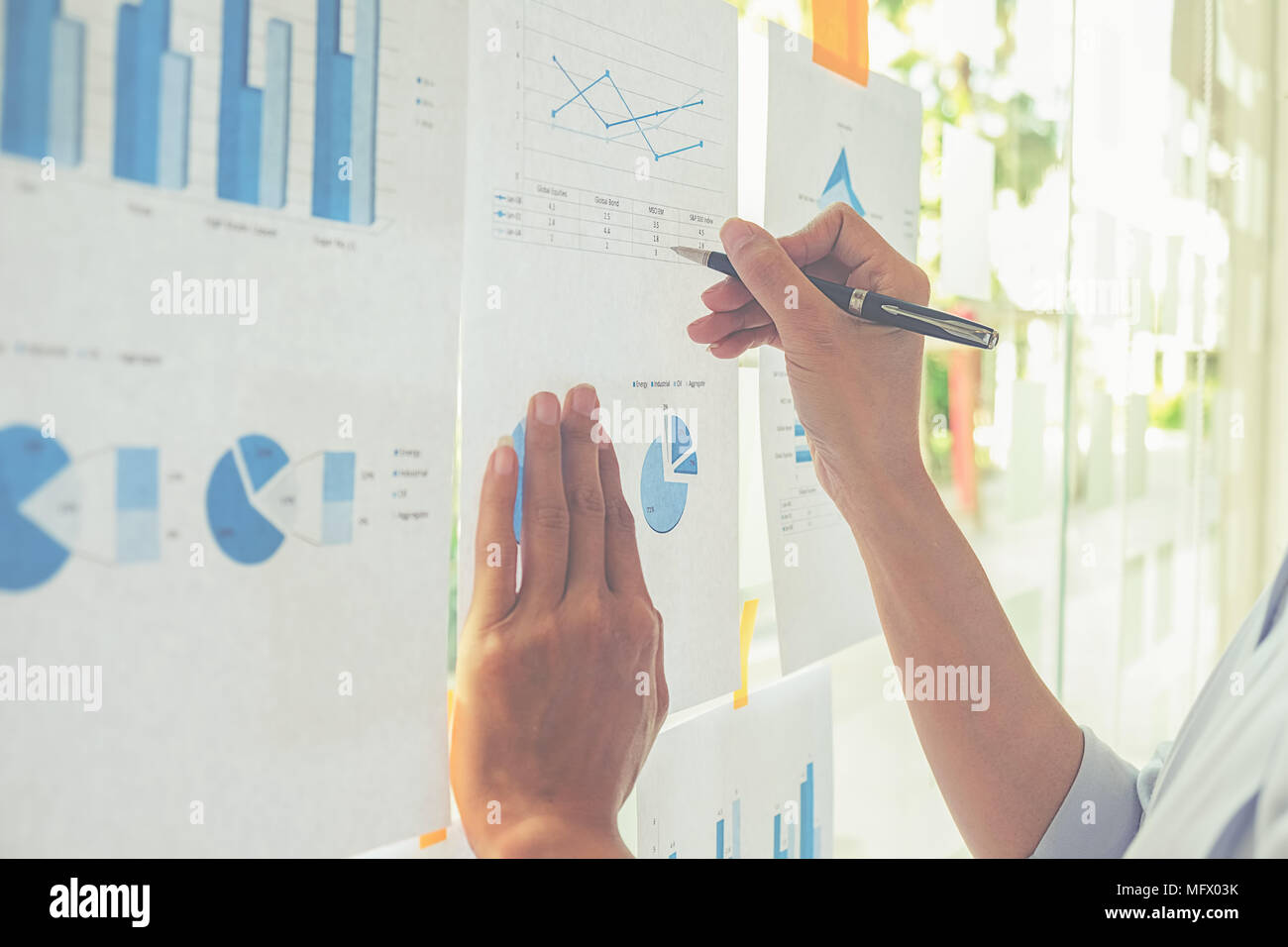 Business concept. Business people discussing the charts and graphs ...