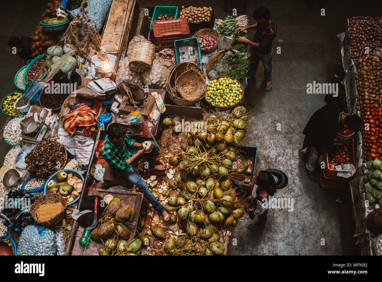 colorful busy fruit and produce market on a warm day in tropical Goa ...