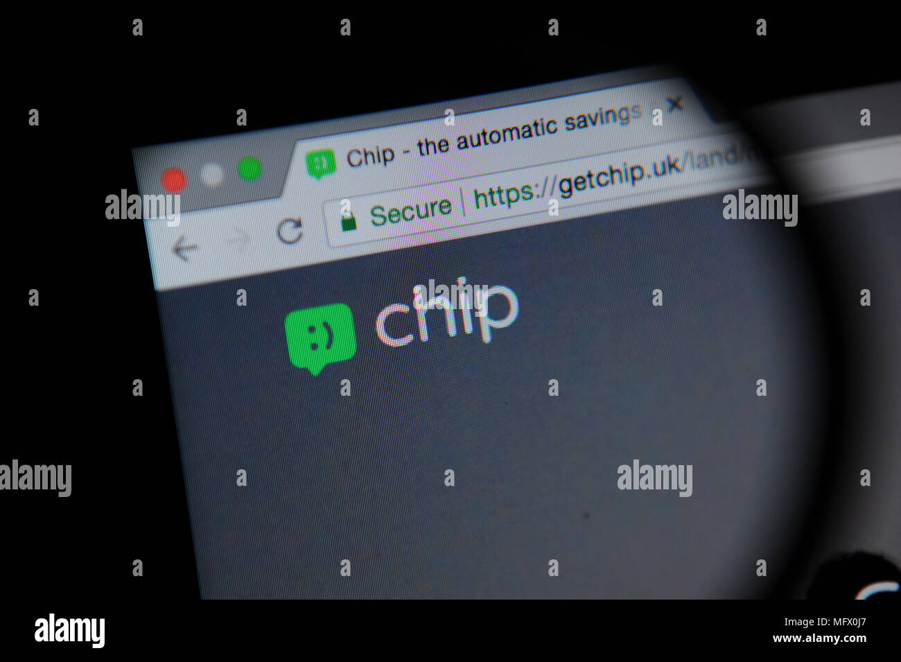 Chip website seen through a magnifying glass. Chip is an app which ...