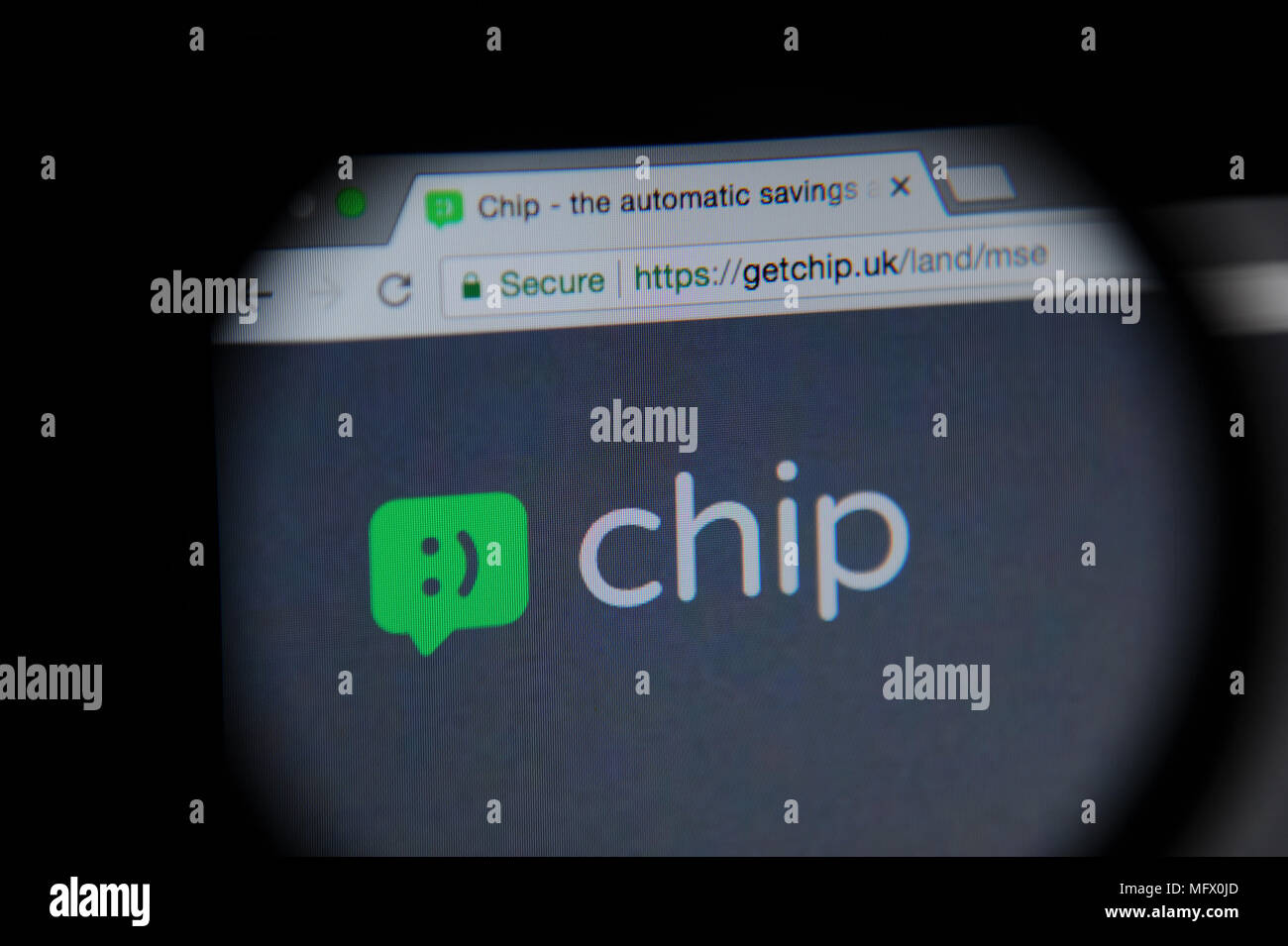 Chip website seen through a magnifying glass. Chip is an app which ...