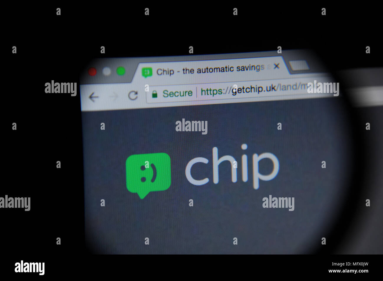 Chip website seen through a magnifying glass. Chip is an app which ...