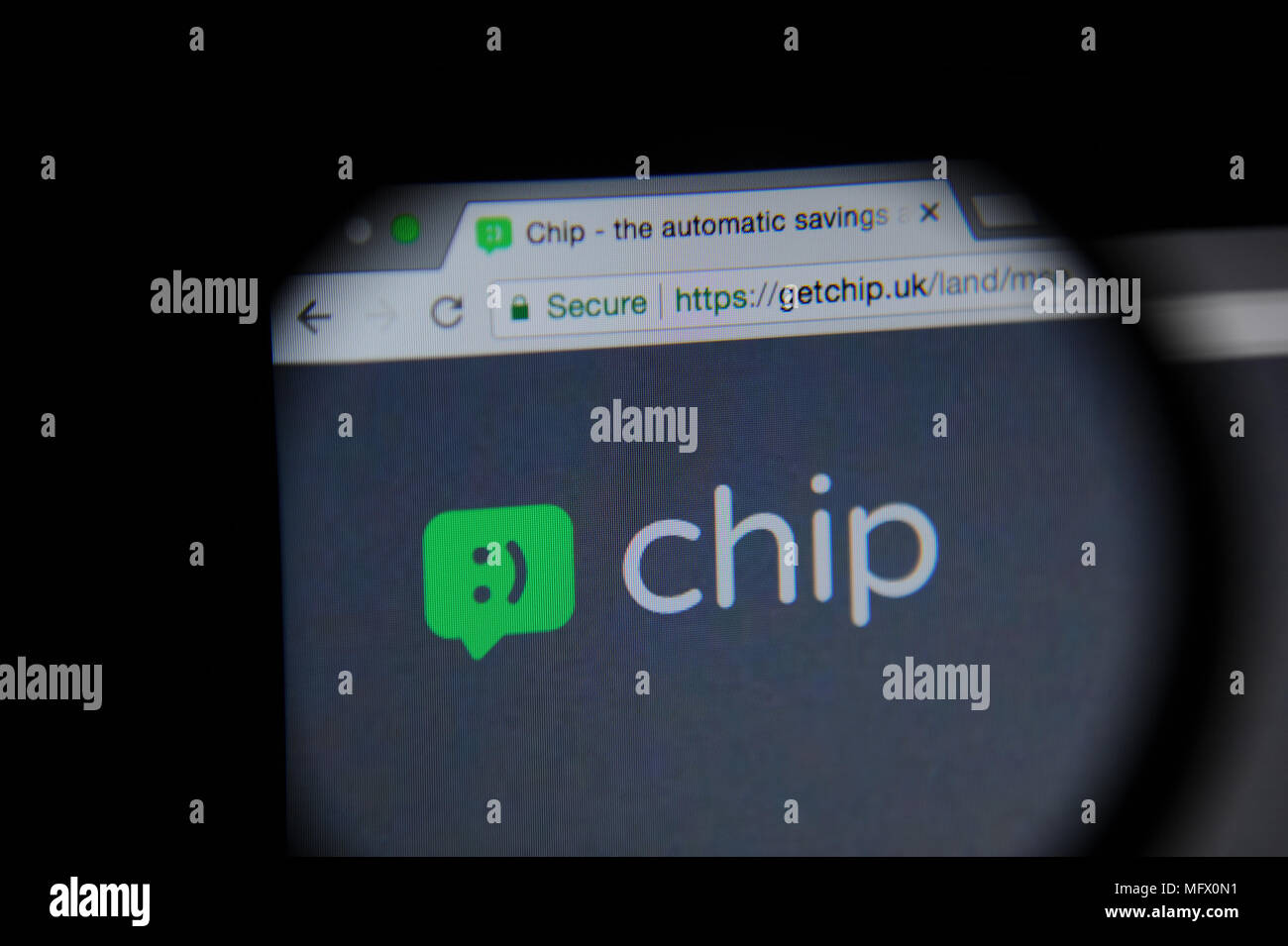 Chip website seen through a magnifying glass. Chip is an app which ...