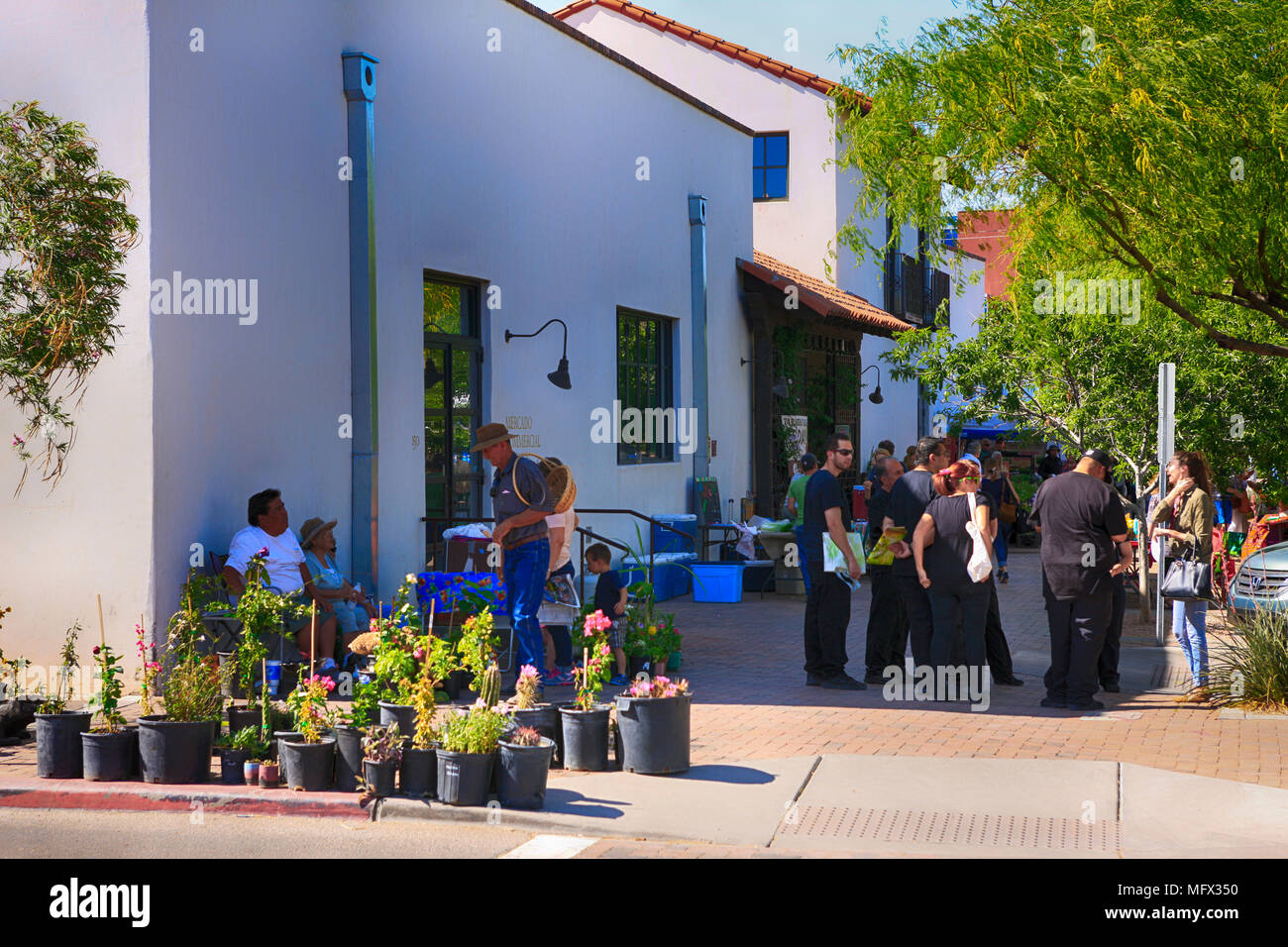 People shopping at the farmers market outside the Mercado San Agustin ...