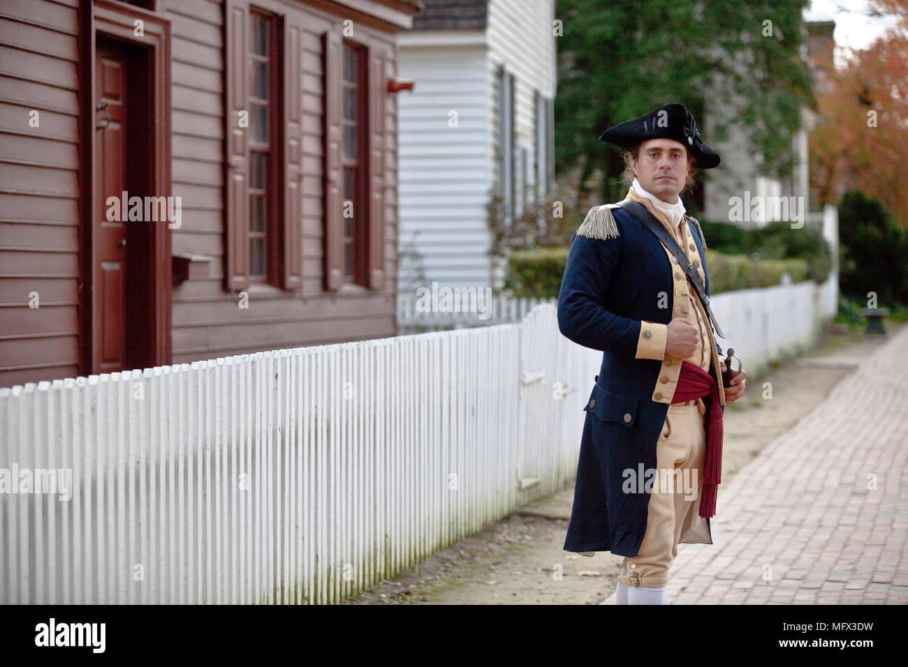 Military officer In dress uniform posing for a portrait in front of a ...