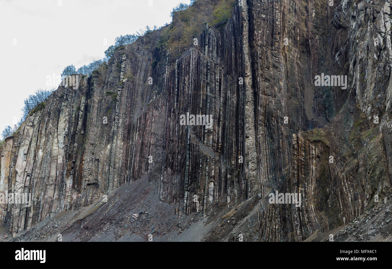 Vertical layers of rock in the mountains Stock Photo - Alamy