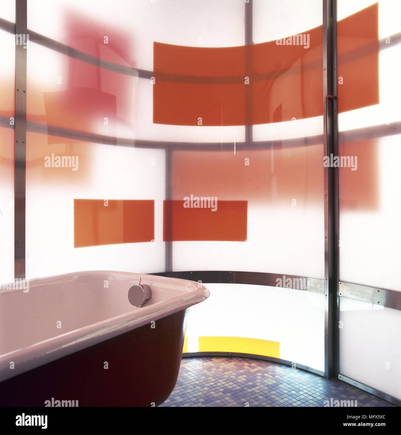 Modern bathroom detail with a freestanding roll top bathtub, mosaic ...