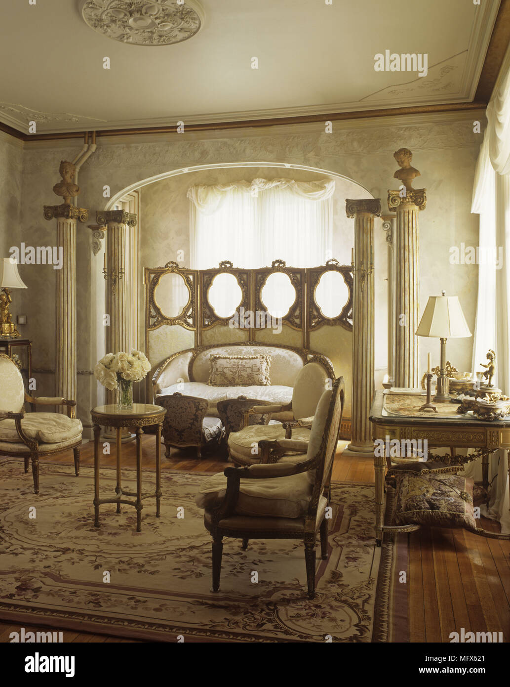 A traditional sitting room with a classical style theme archway Doric ...