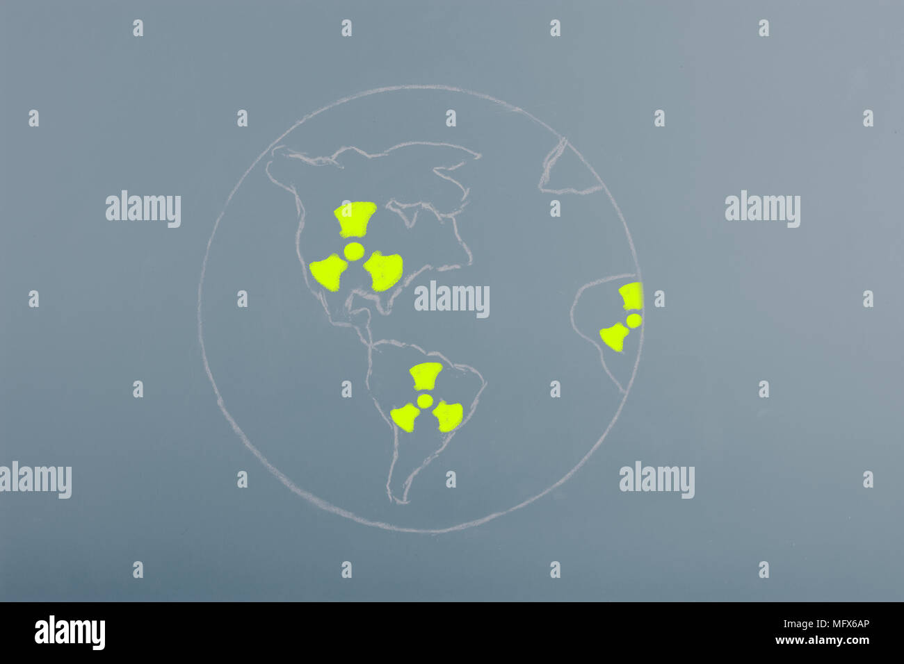 Radioactive radiation warning on the earth planet Stock Photo - Alamy