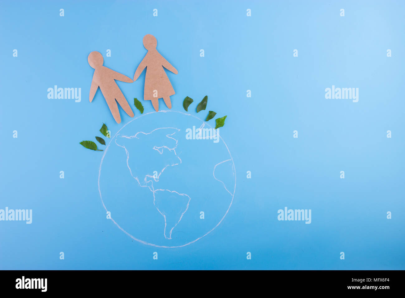 family made from paper stand on planet earth Stock Photo - Alamy