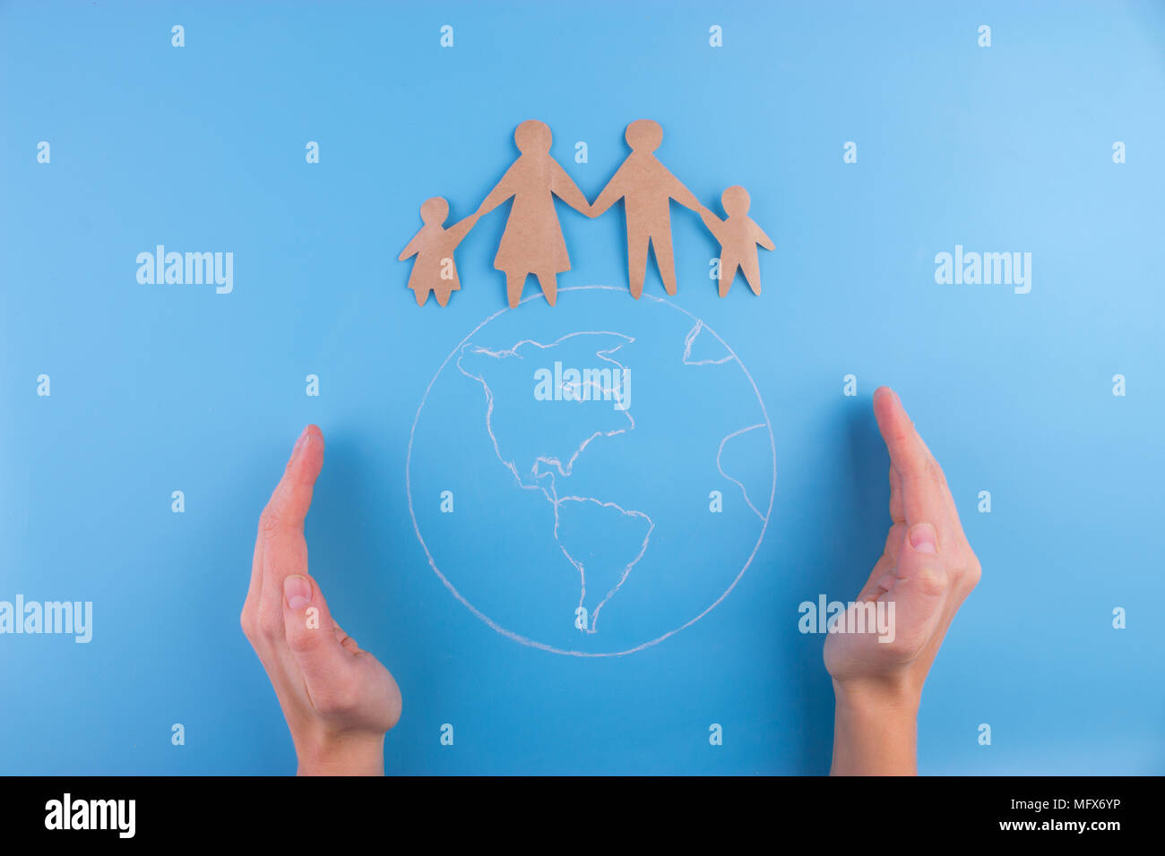 family made from paper stand on planet earth Stock Photo - Alamy