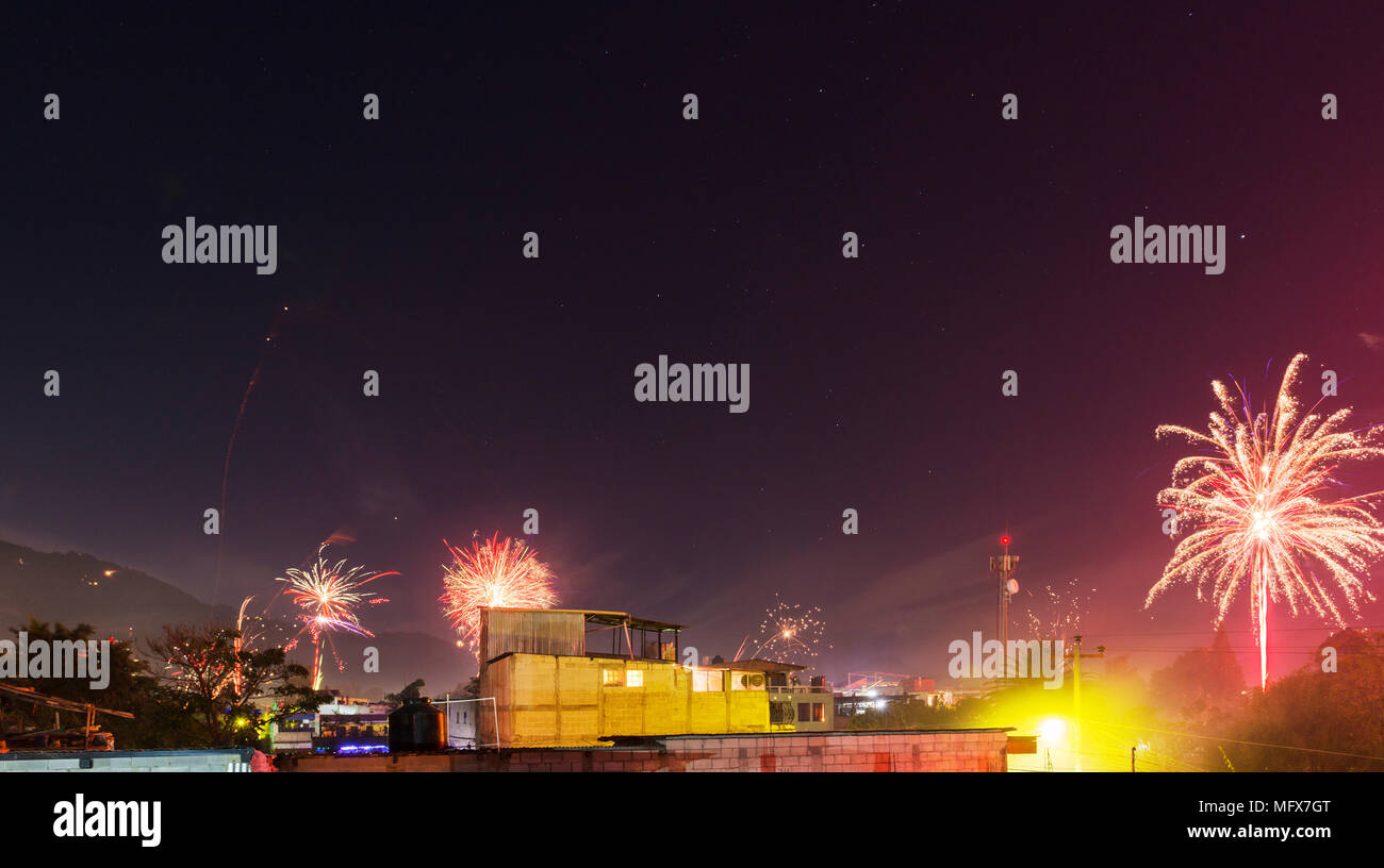 Fireworks light up the night sky on New Years Eve in Guatemala Stock ...