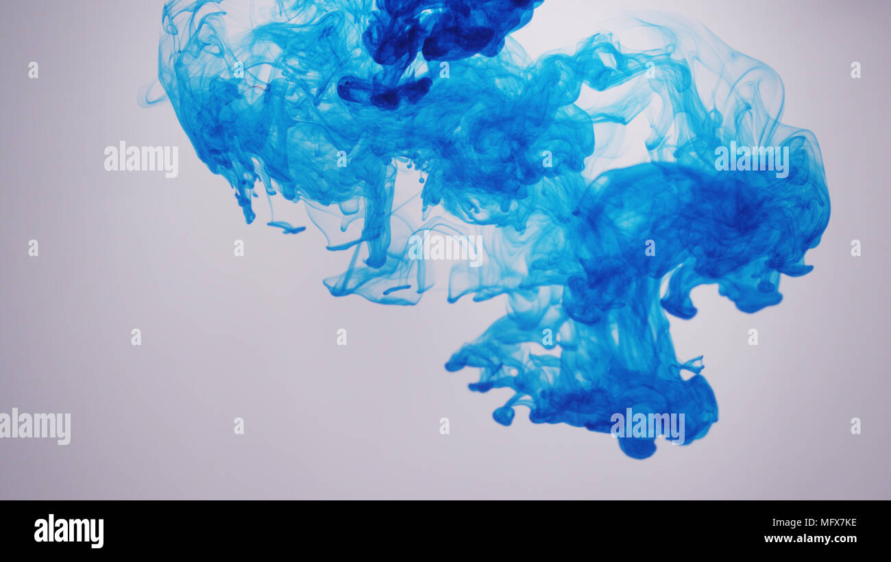 Blue ink/smoke in front of white background Stock Photo - Alamy