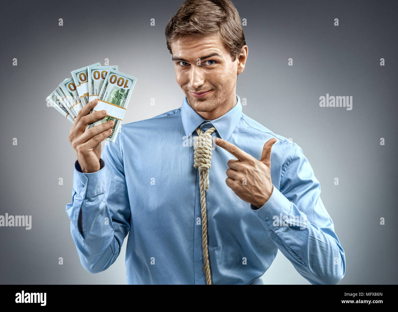 Man holding cash money and pointing a finger at them. Photo of smiling ...