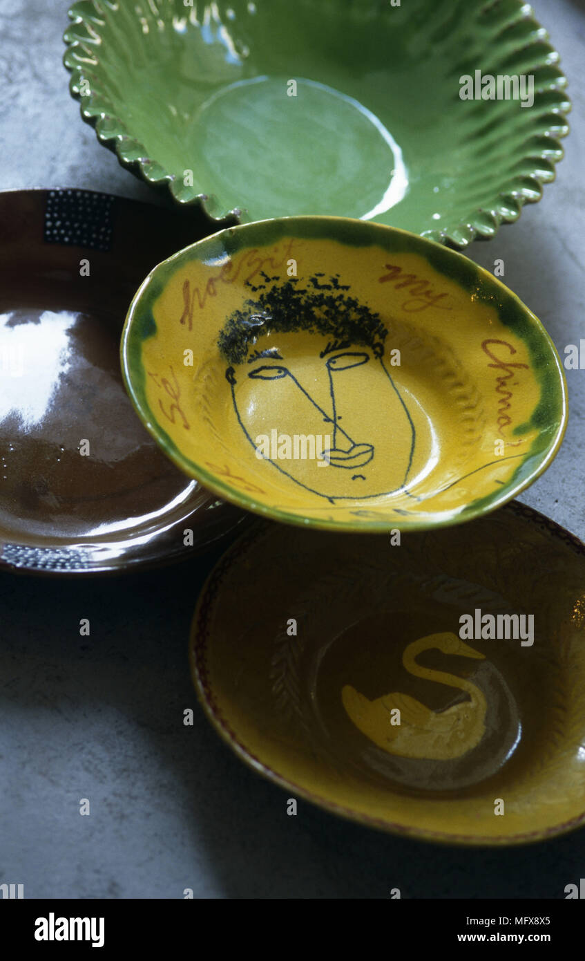 Four ethnic style pottery dishes Stock Photo - Alamy