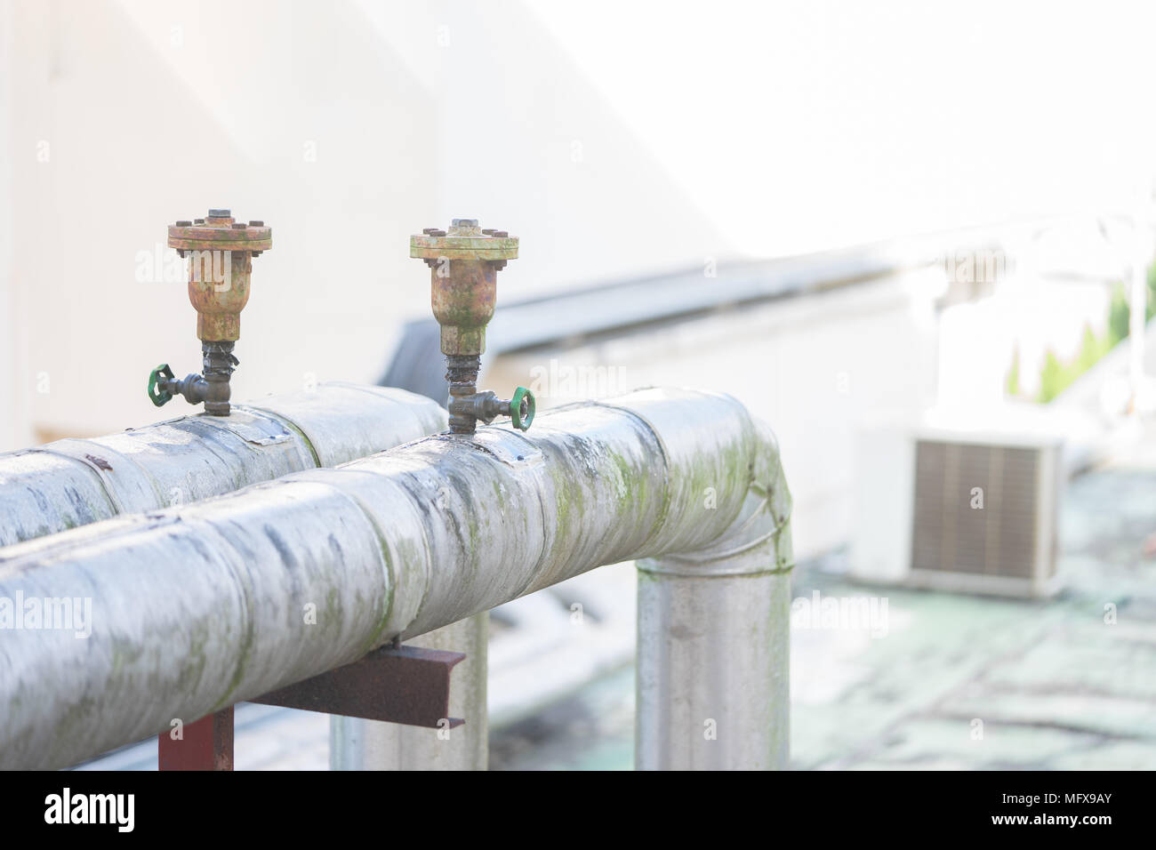 Rusty Old Heating Cooling Water Plumbing Pipes with Valves in hospital ...