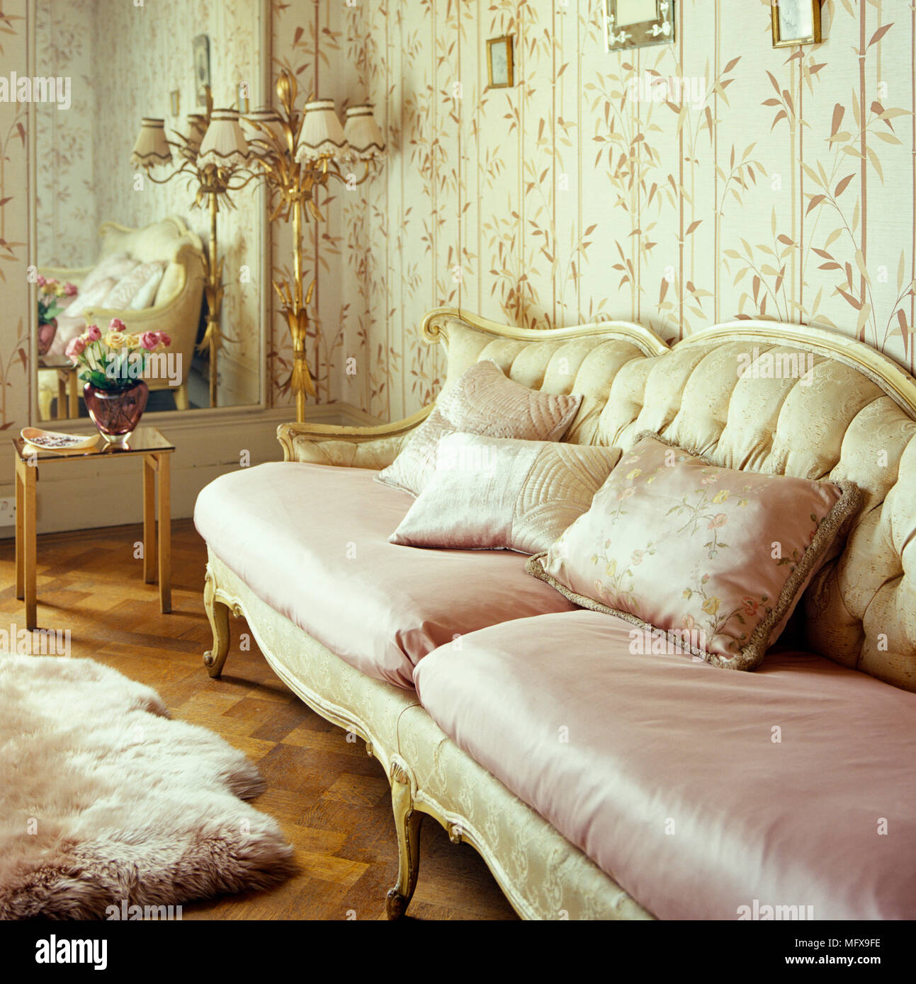 Period sofa in traditional style room with pattern wallpaper Stock ...