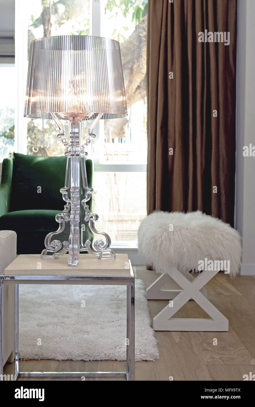 Lamp on side table in modern sitting room Stock Photo - Alamy