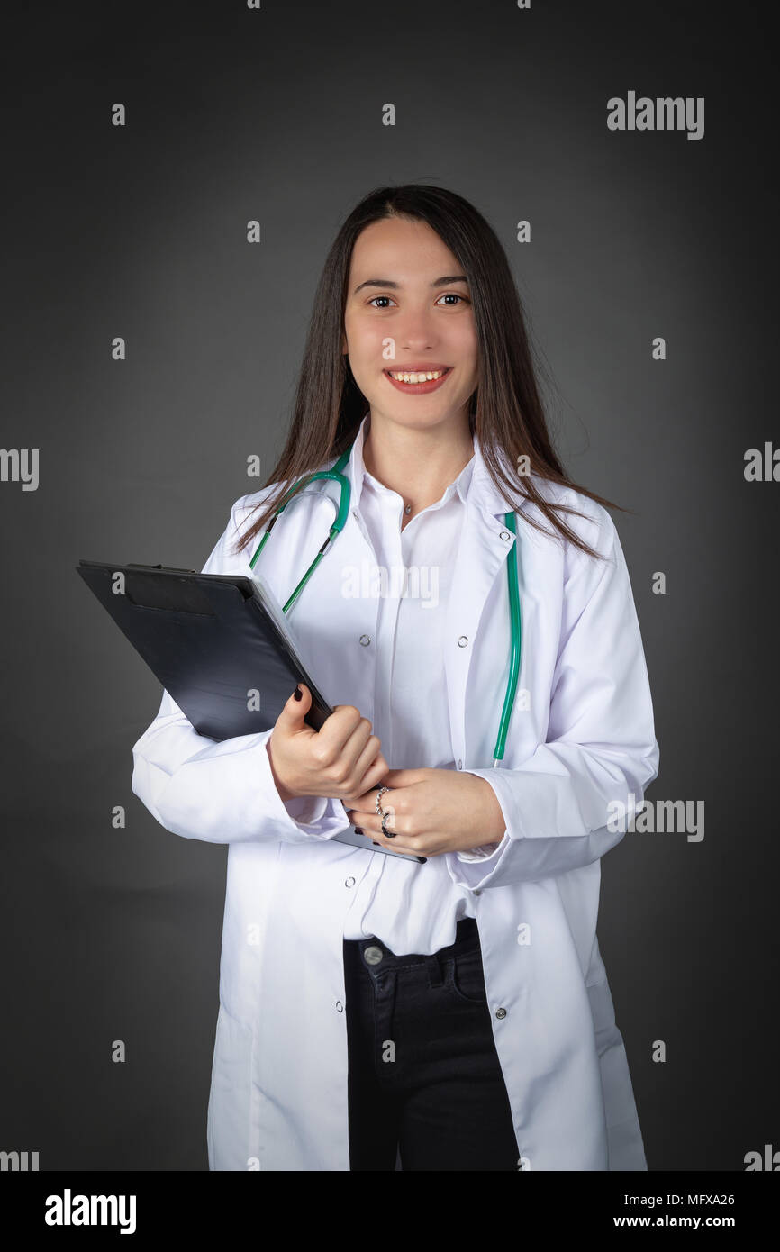 Beautiful smiling Turkish female doctor woman with patient file in her ...