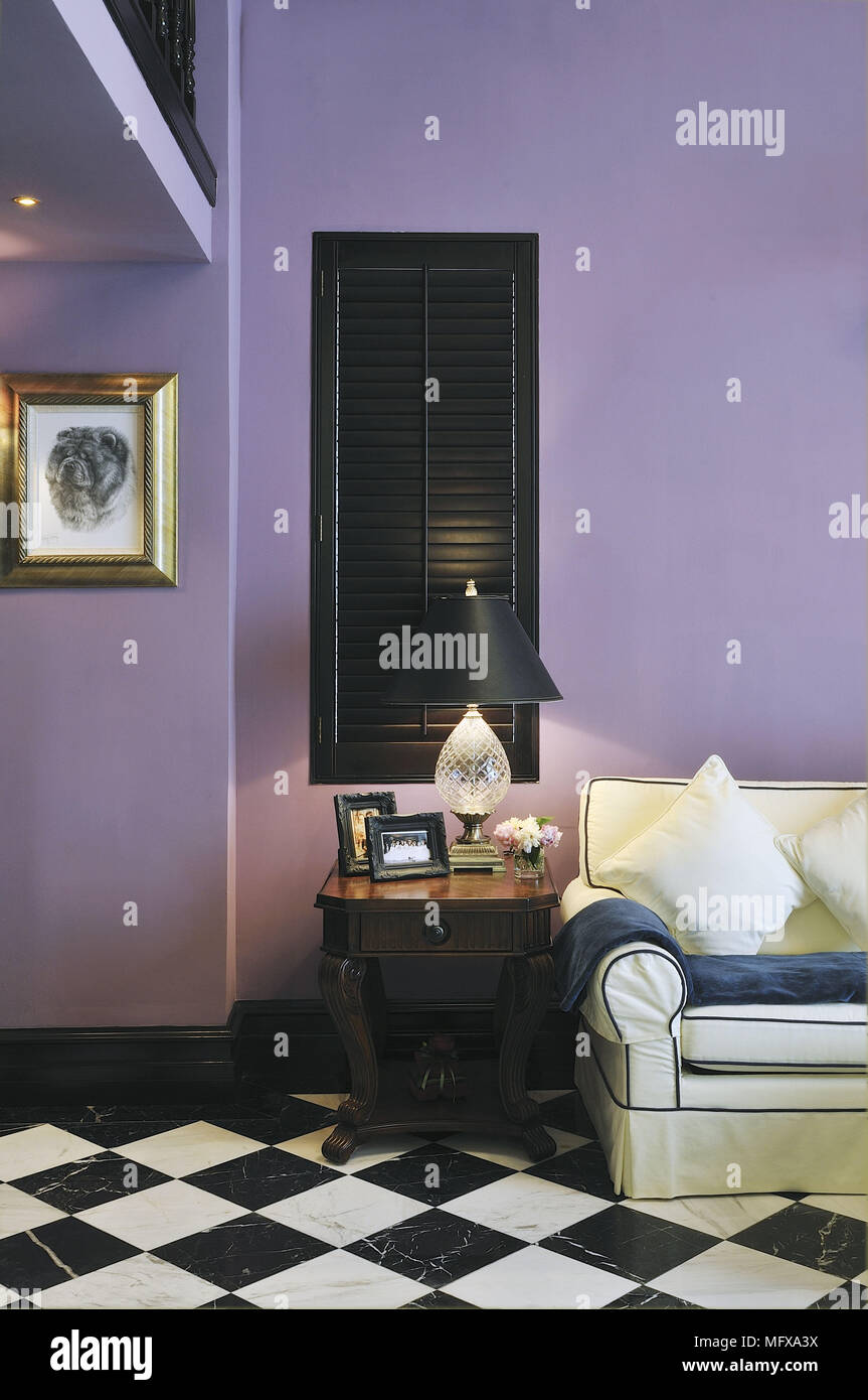 Lamp on side table next to sofa in traditional style room Stock Photo ...