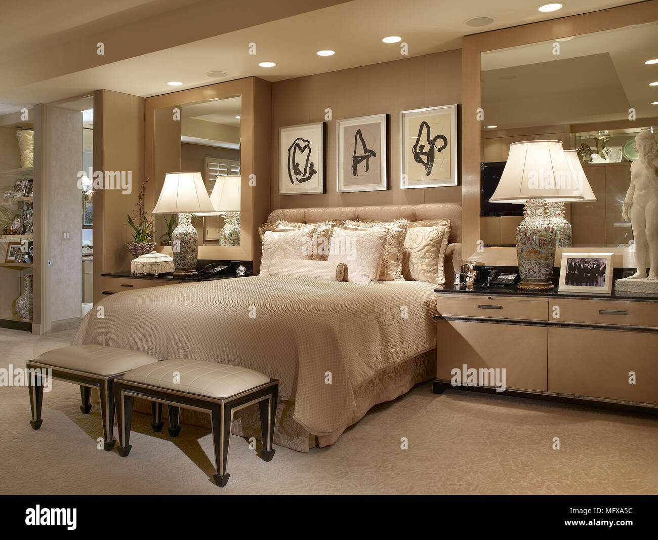 Double bed with fitted units either side in traditional style bedroom ...