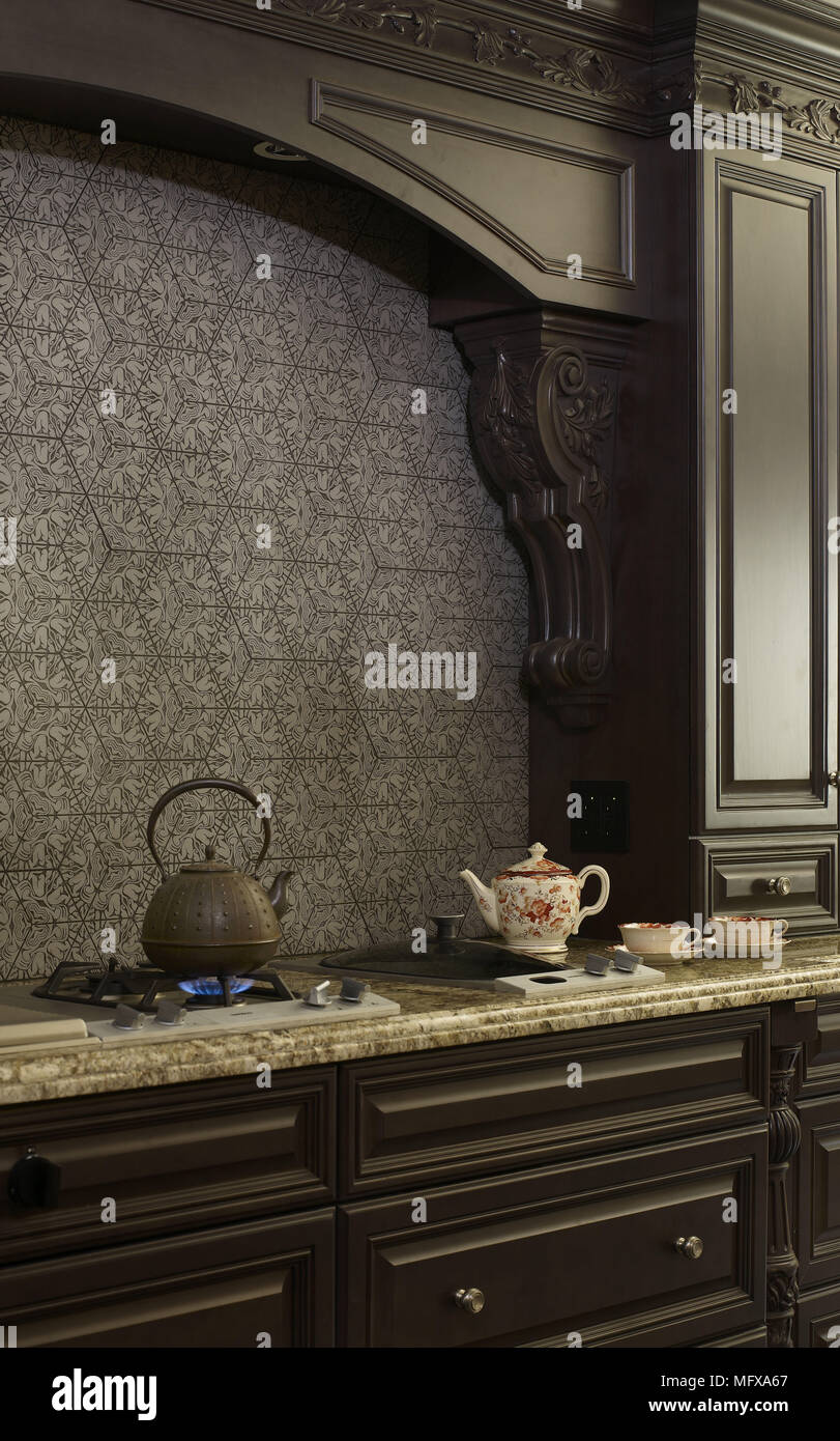 Gas hob set in traditional style kitchen with wooden units Stock Photo ...