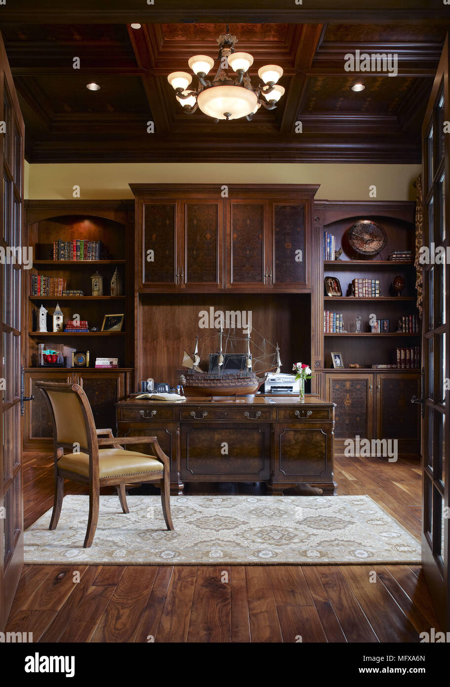 Leather chair and desk in traditional style study Stock Photo - Alamy