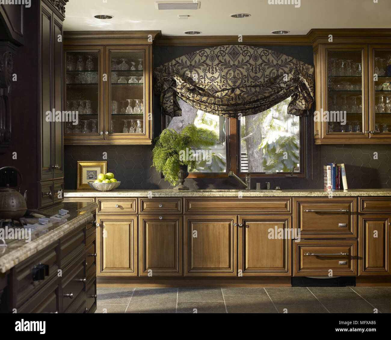 Sink set in traditional style kitchen with wooden units Stock Photo - Alamy